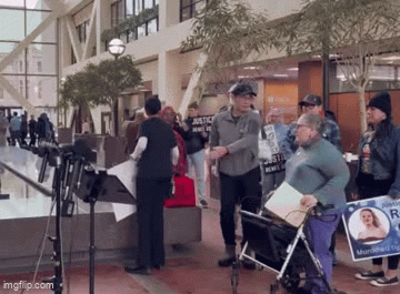 ICE protesters being directed and put into position with their Justice ...